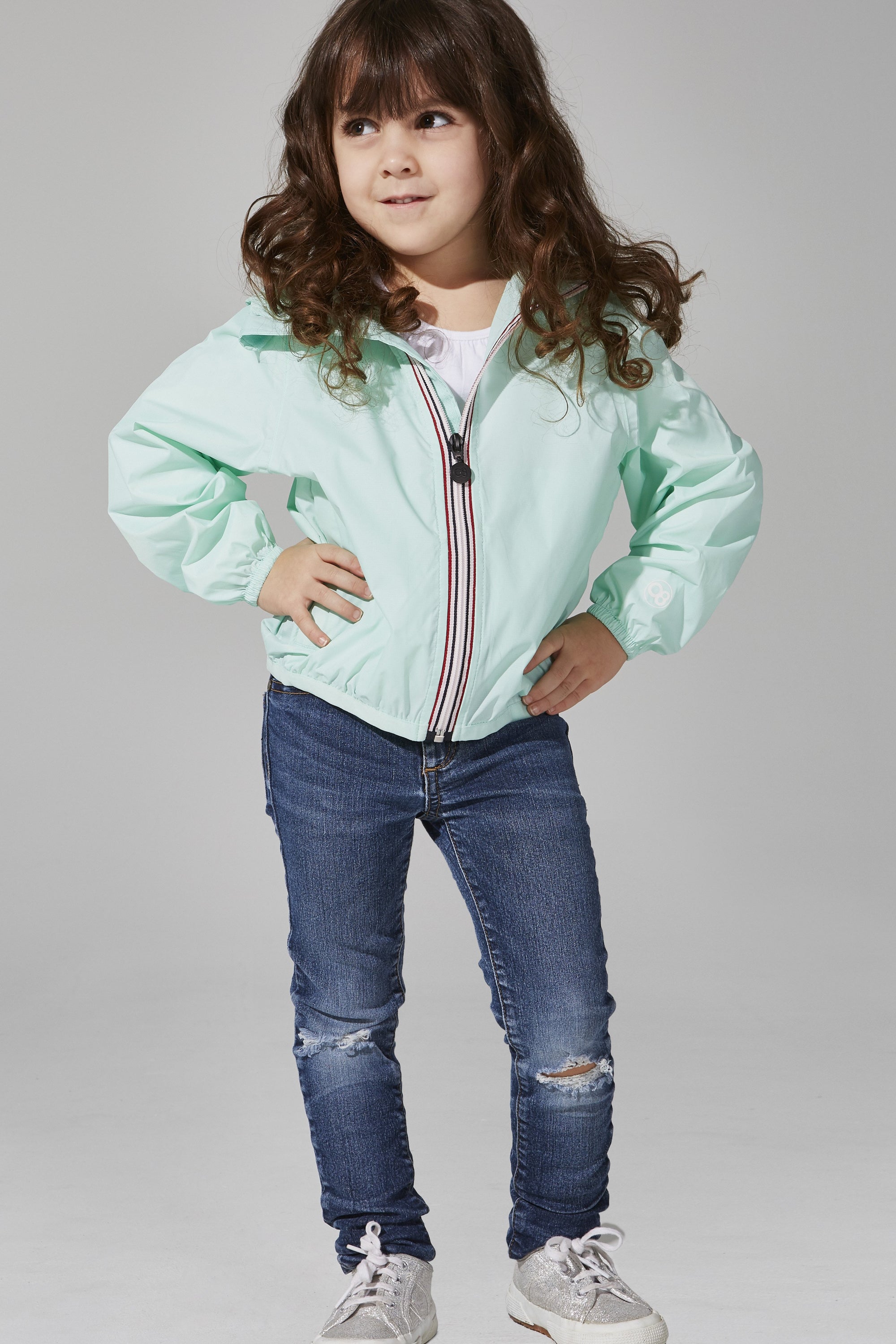 Kids packable rain jacket and windbreaker in mint green